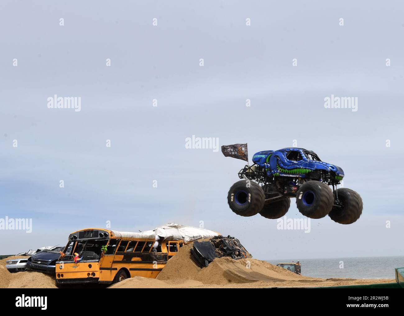 Monster trucks on cars hi-res stock photography and images - Alamy