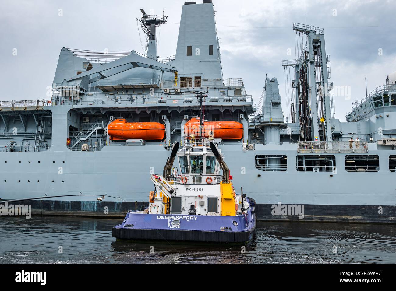 RFA Forth Victoria naval ship (A387) pushed by a tugboat at Leith ...