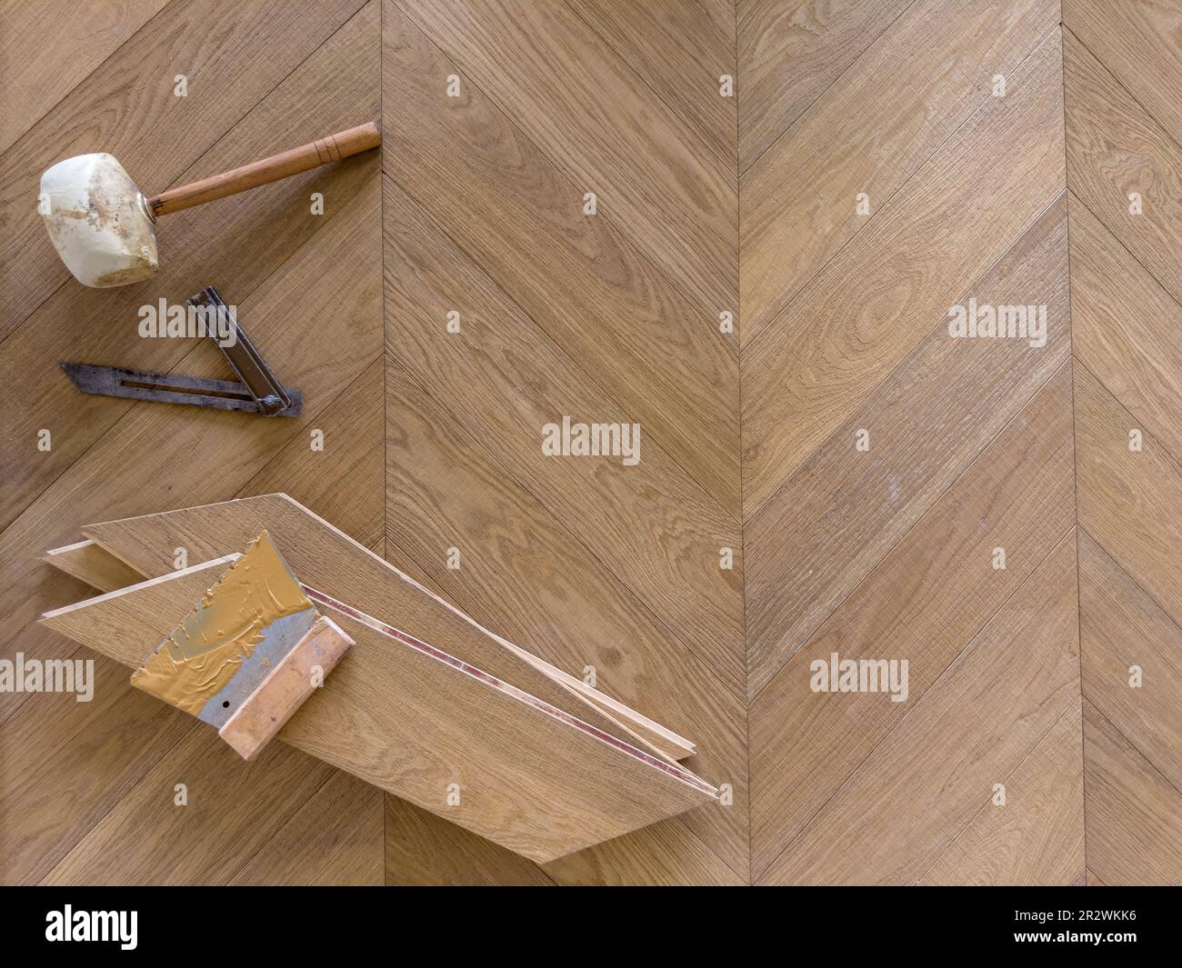 Parquet is relaid, tools for work, parquet boards Stock Photo - Alamy
