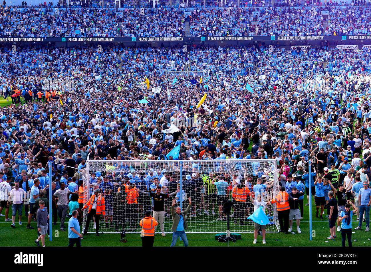 Manchester City fans invade the pitch as they celebrate their Premier ...
