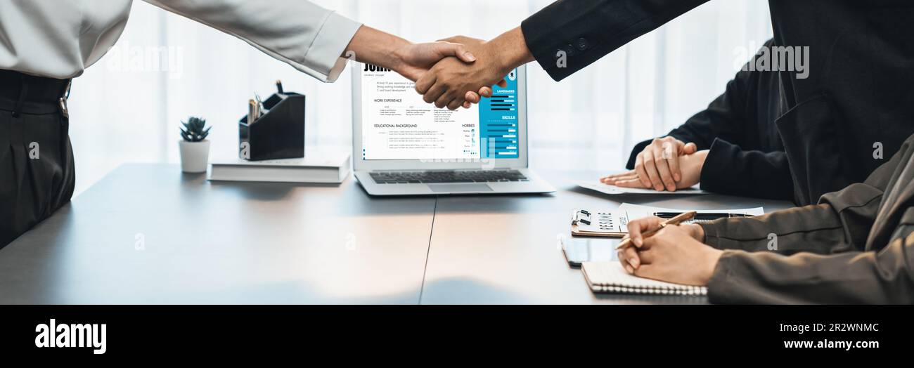 Interviewer handshaking the applicant hi-res stock photography and ...