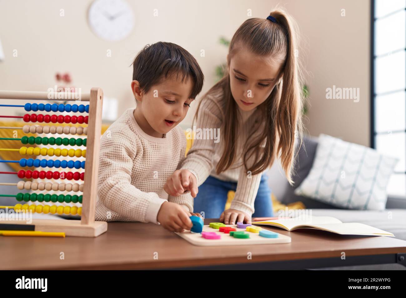 Children playing game calculator hi-res stock photography and images ...