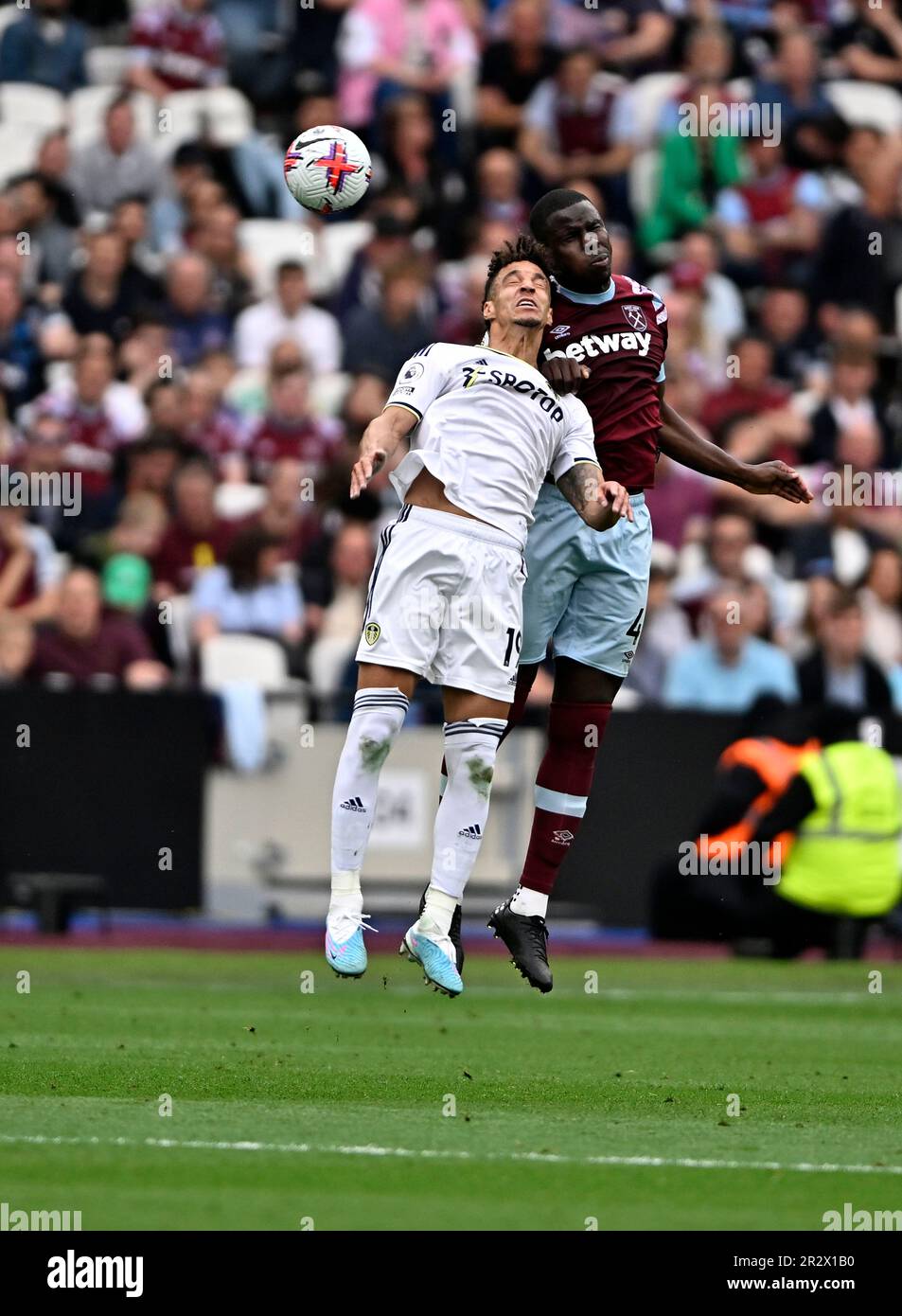 London, UK. 21st May, 2023. Rodrigo (Leeds) and Kurt Zouma (West Ham ...