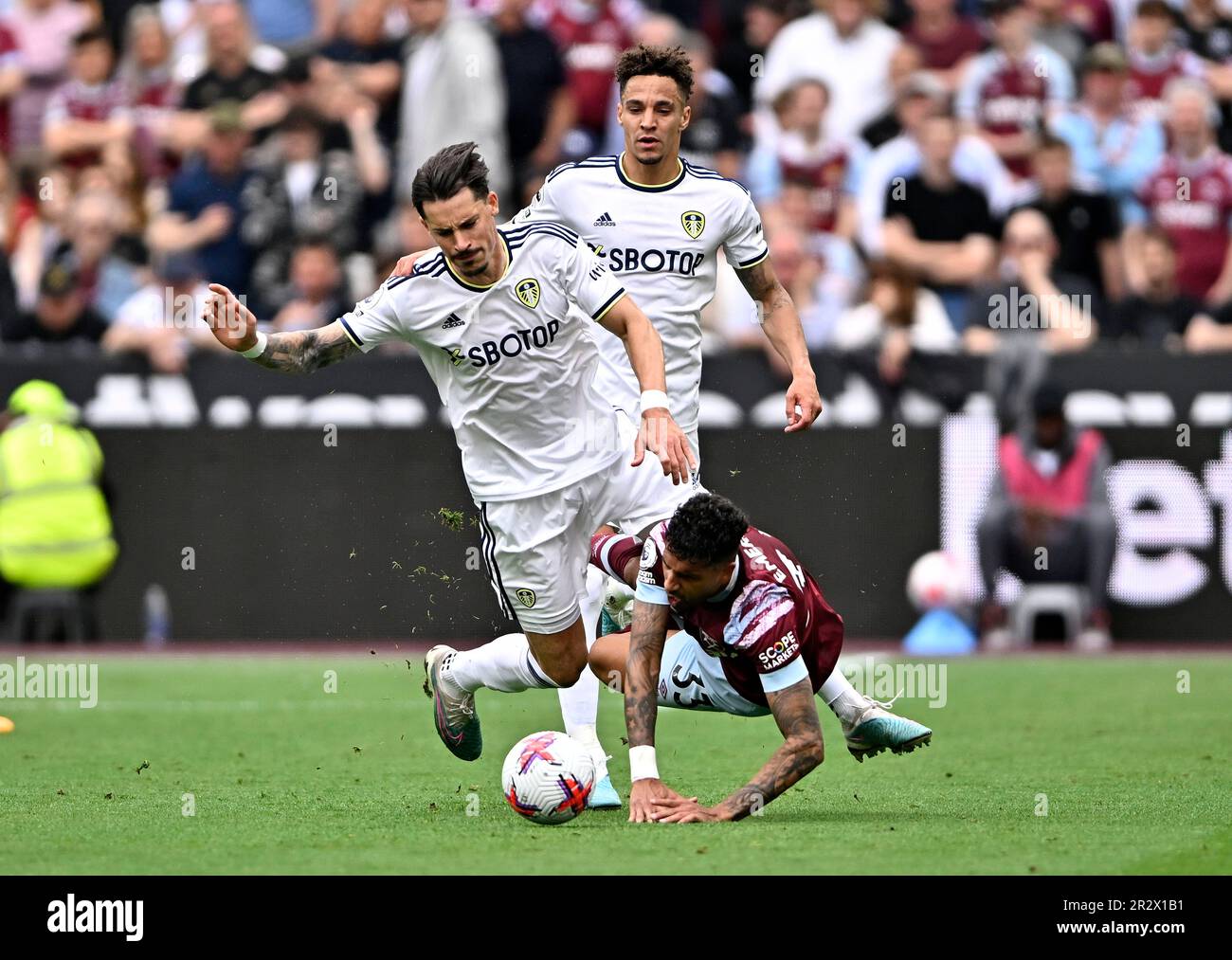 London, UK. 21st May, 2023. Emerson (West Ham) is tumbled over by Robin ...