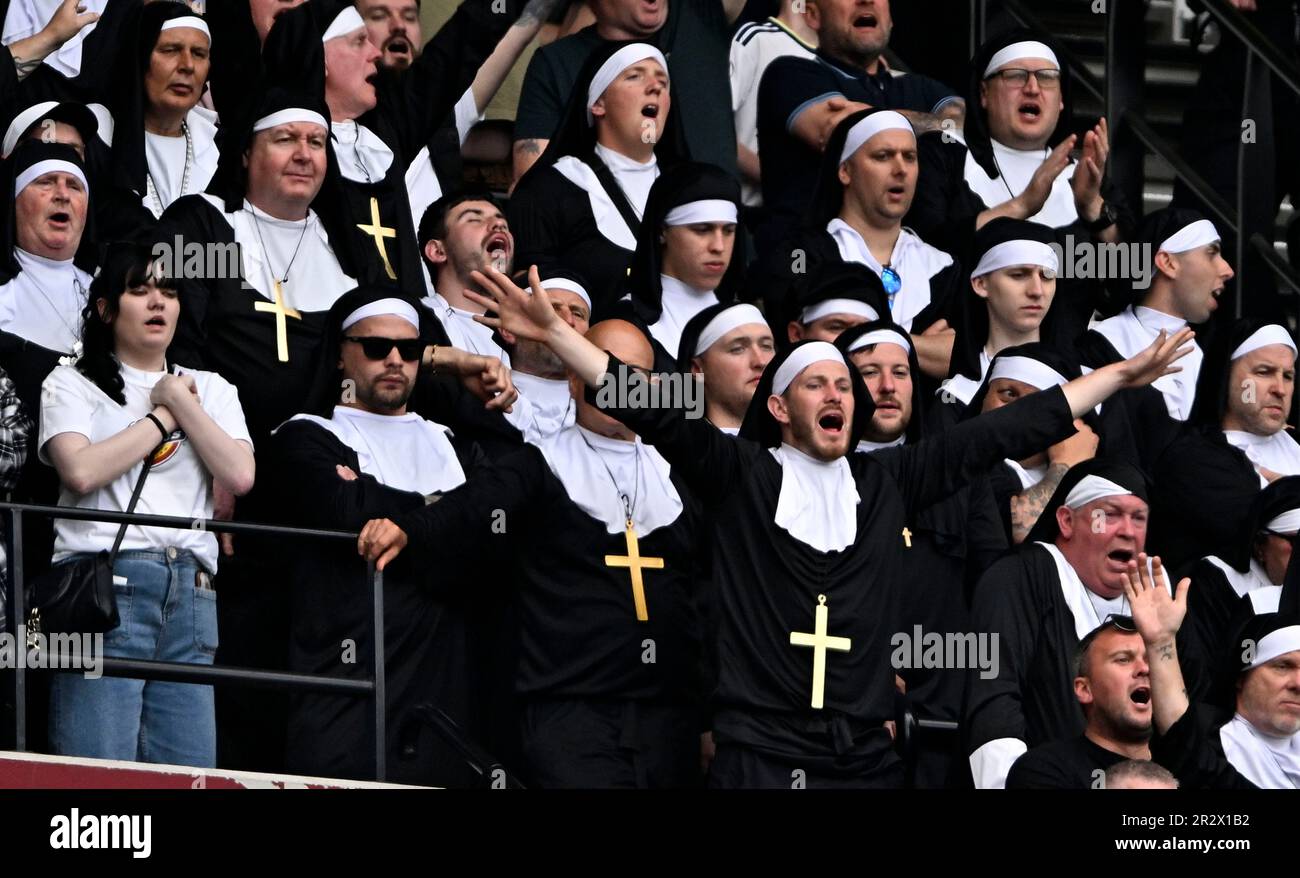 London, UK. 21st May, 2023. A section of Leeds fans dressed as nuns ...