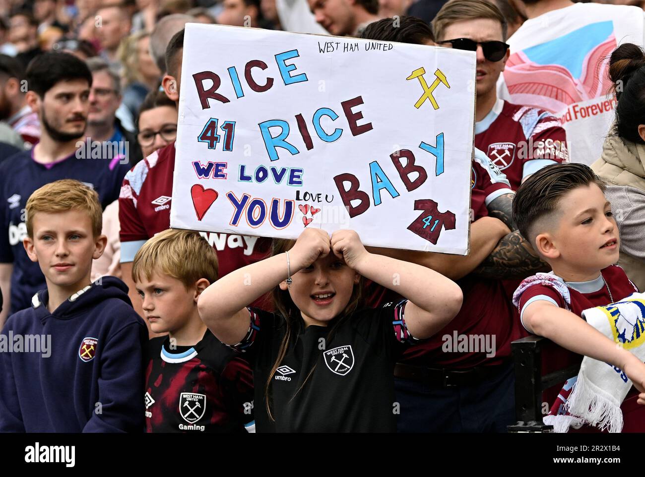 London, UK. 21st May, 2023. A young fan holds up a sign that says 'rice ...