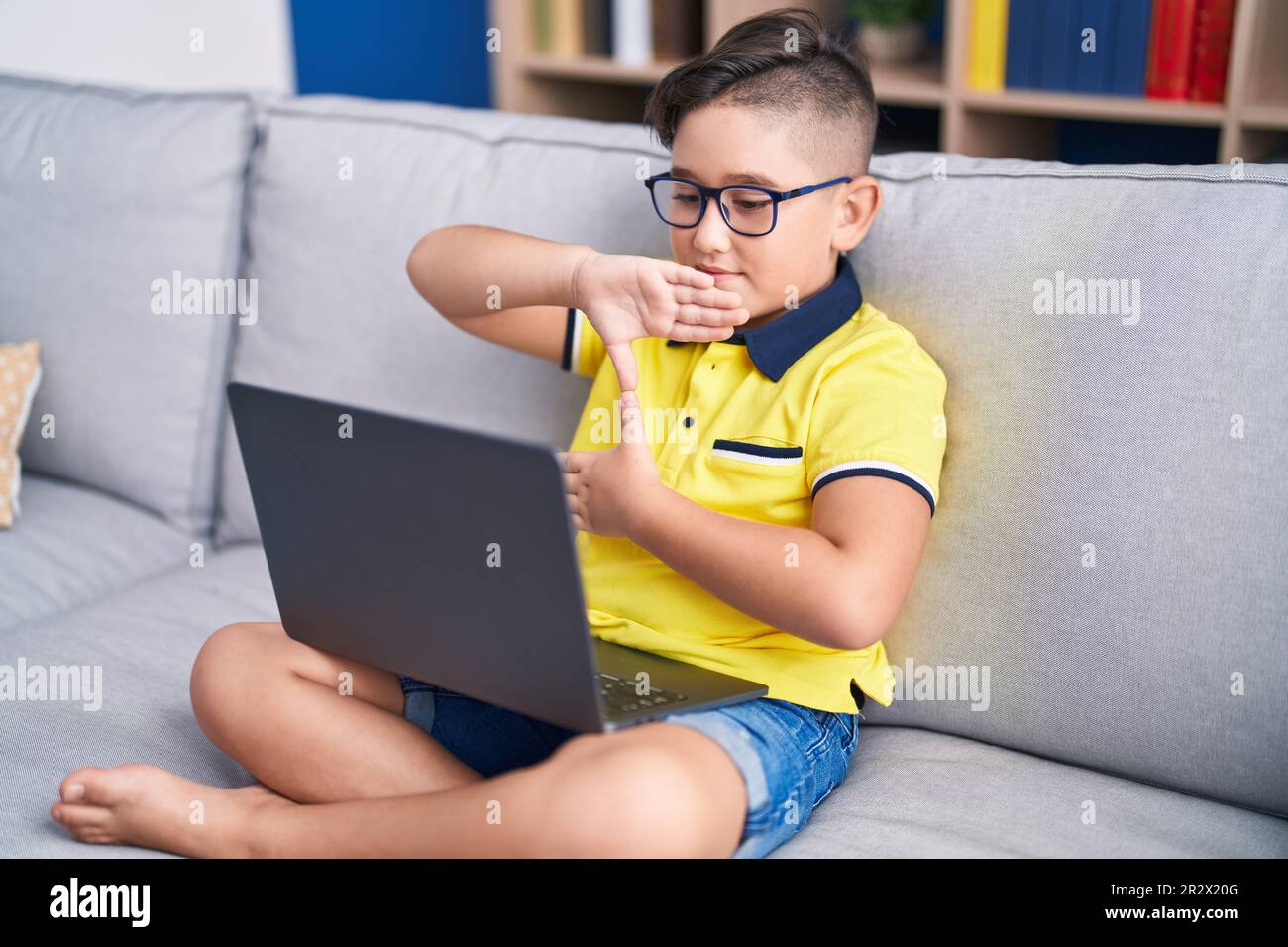 Adorable hispanic boy having video call communicate with sign deaf ...