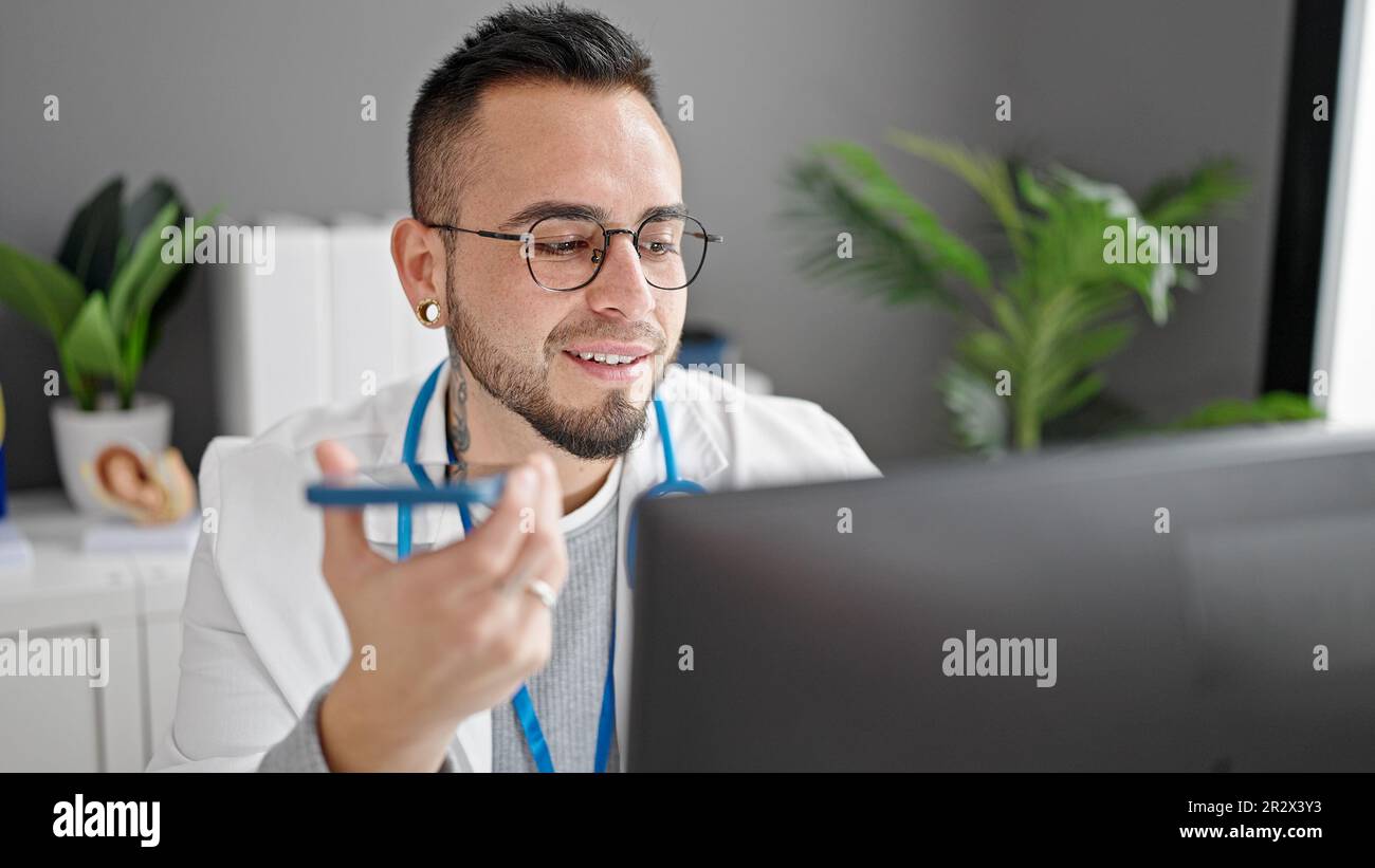 Hispanic man doctor sending voice message at the clinic Stock Photo - Alamy