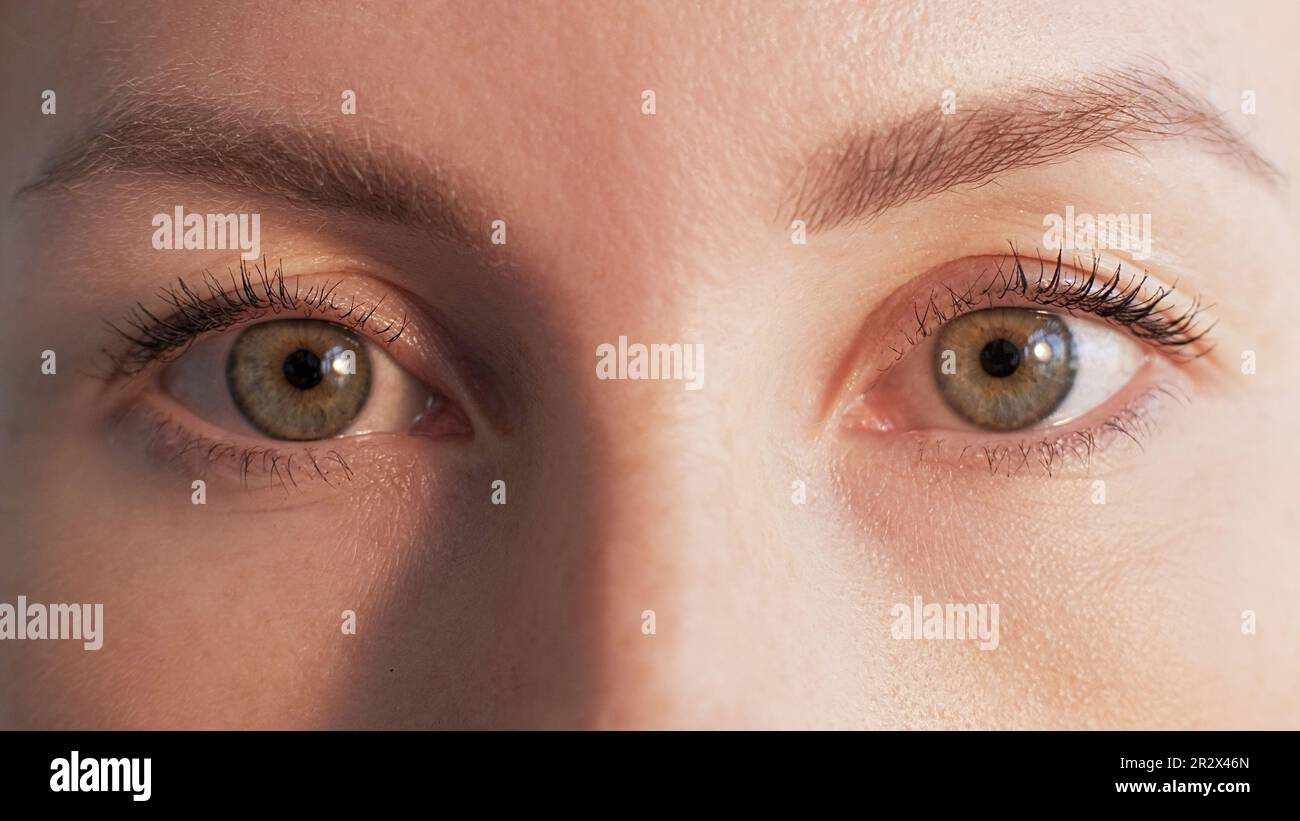 Eye care vision correction woman face staring look Stock Photo - Alamy