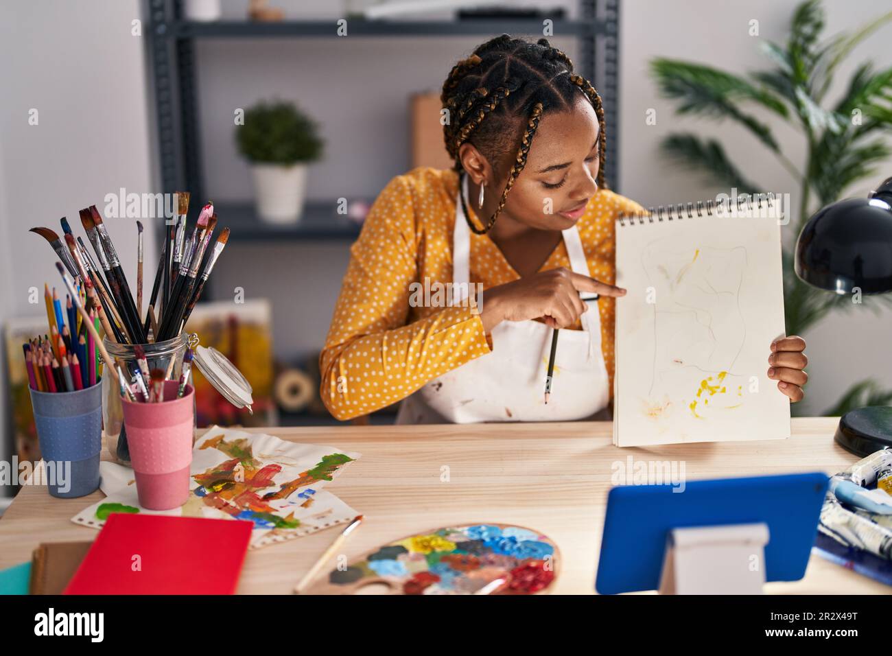 African american woman artist having online draw lesson at art studio ...