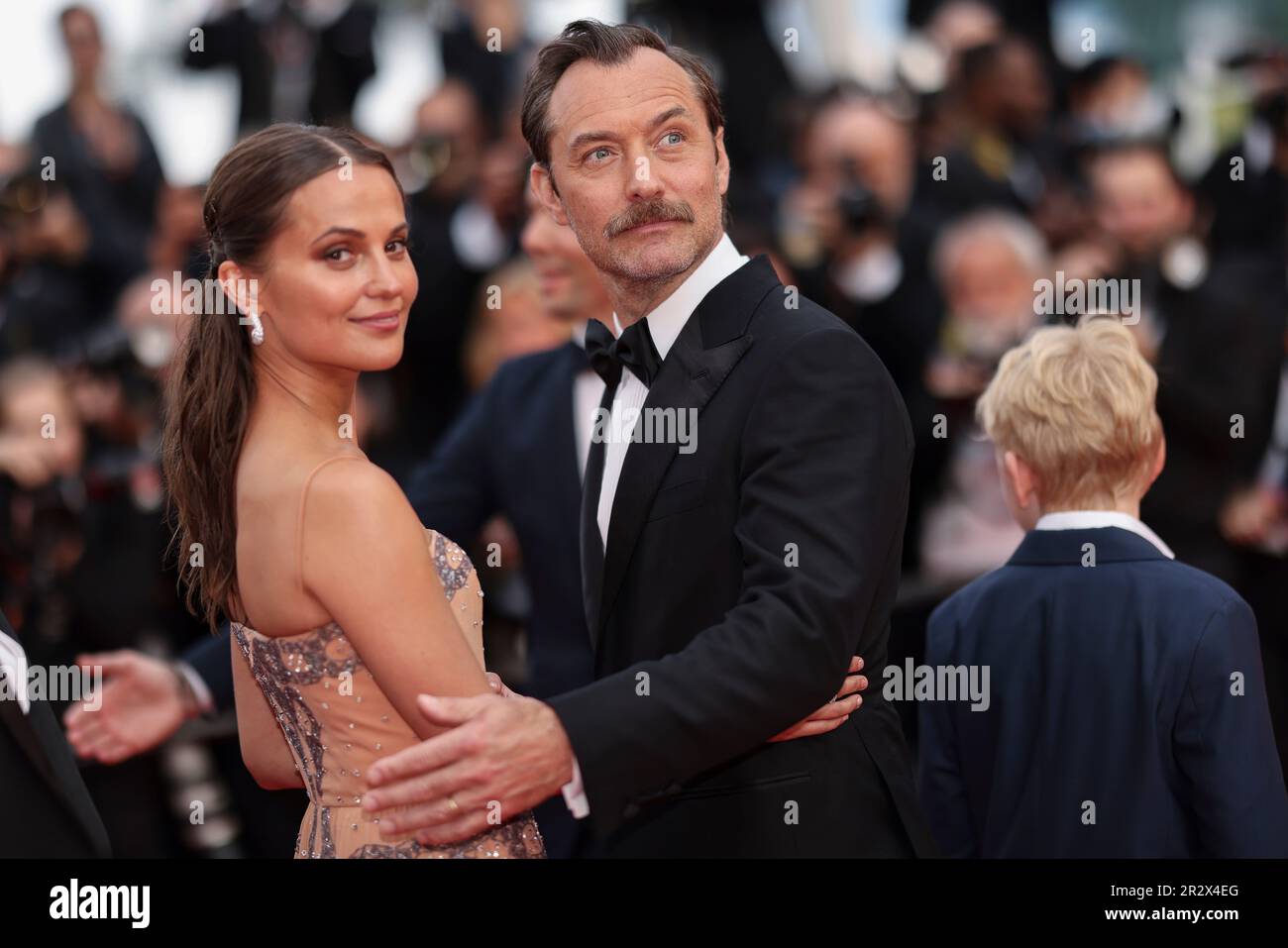 Alicia Vikander, left, and Jude Law pose for photographers upon arrival ...