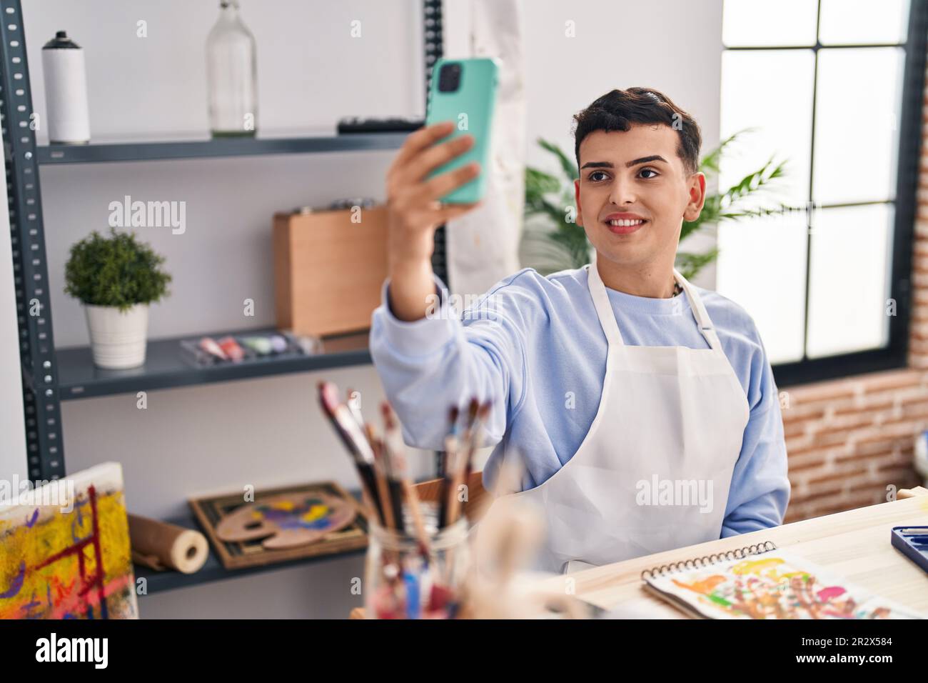 Young non binary man artist smiling confident make selfie by smartphone ...