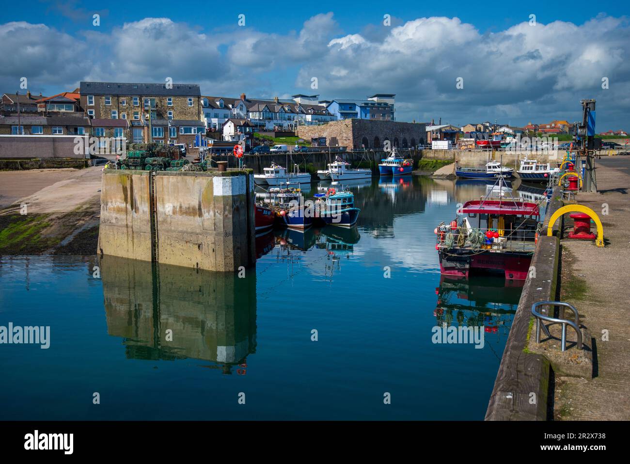 The harbour at low tide at Seahouses on the north east coast of England ...