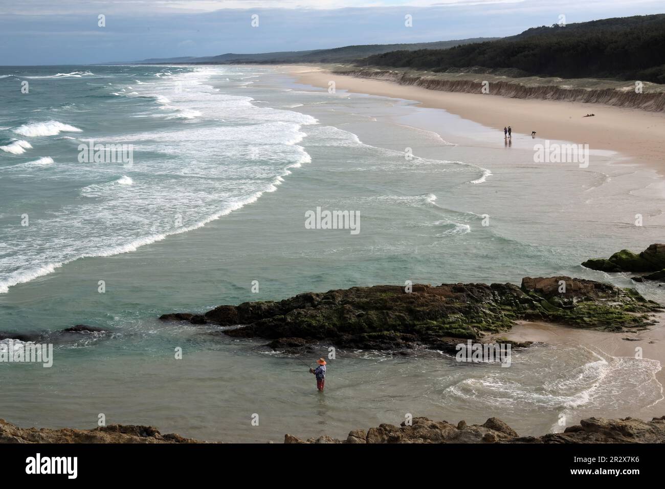 view along beach under a cloudy sky Main Beach, North Stradbroke Island ...