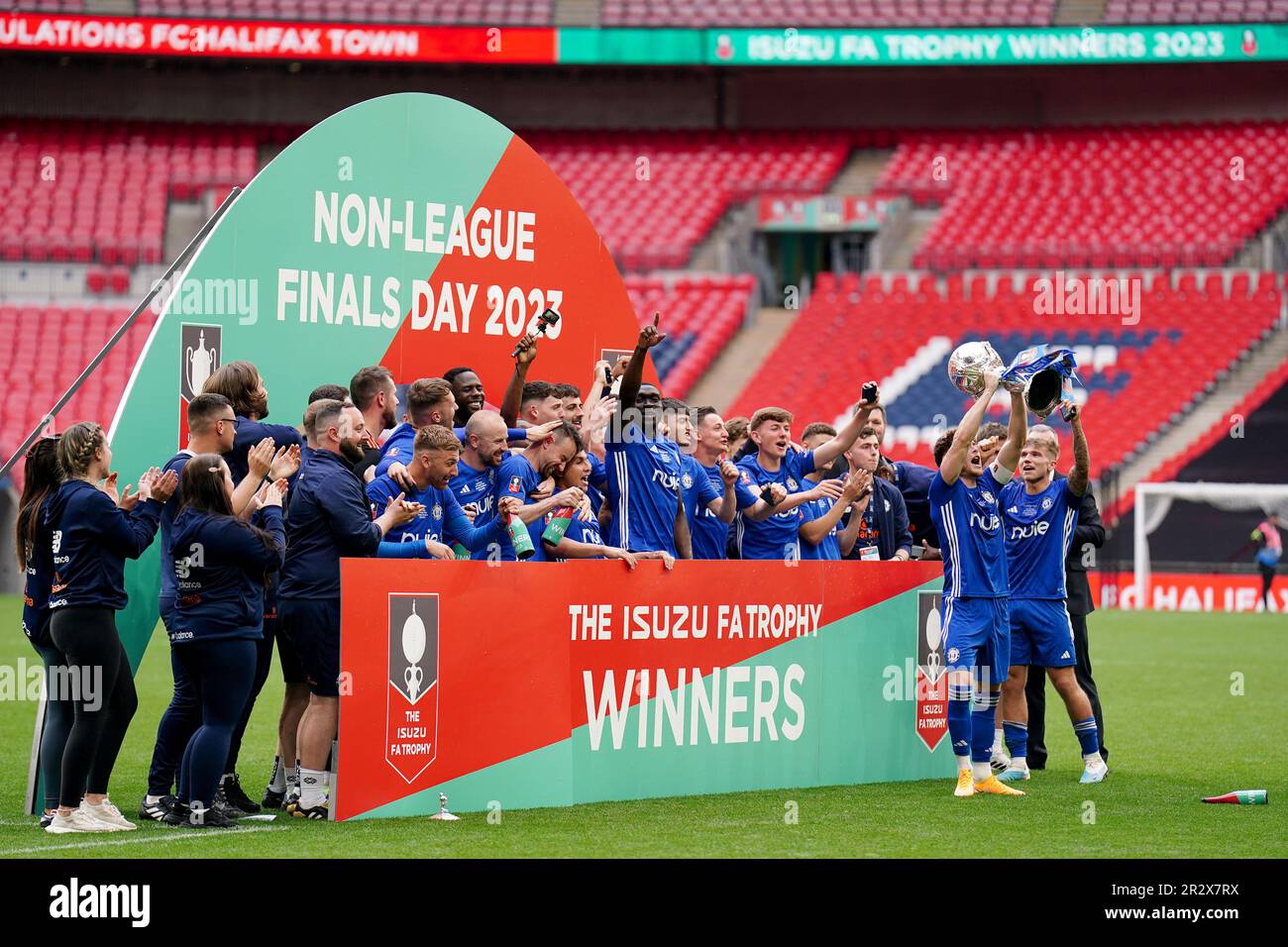 FC Halifax Town players celebrate their win by lifting the trophy ...