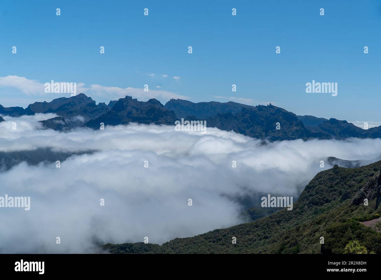 Mountain range and peaks covered in clouds, fog and mist on Madeira ...