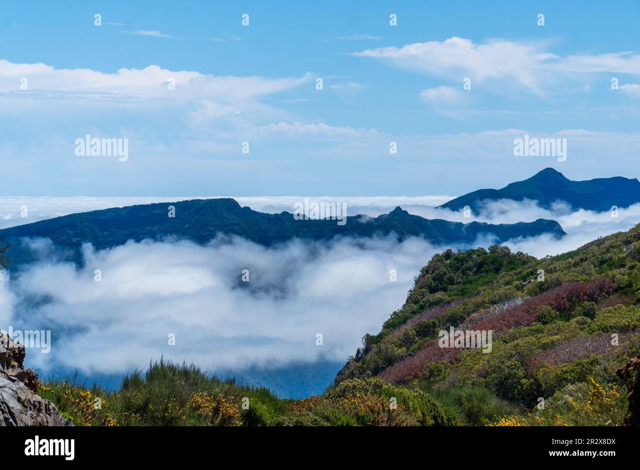 Mountain range and peaks covered in clouds, fog and mist on Madeira ...