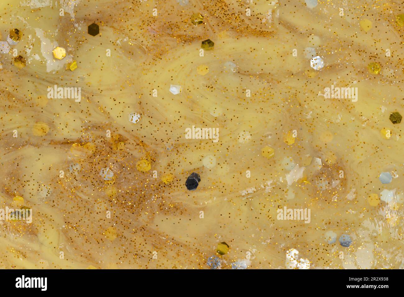 Texture of yellow slime background. Glittery gold color pattern Stock ...