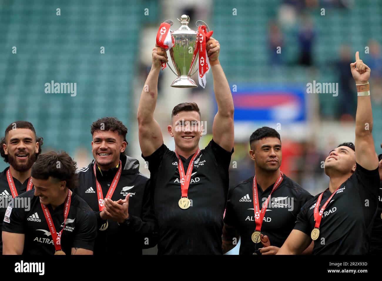 New Zealand's Sam Dickson lifts the HSBC World Series trophy with his ...