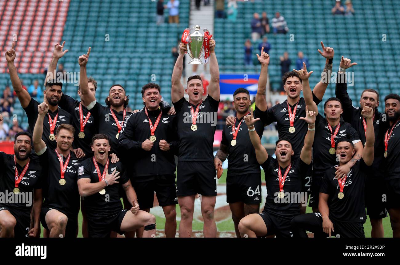 New Zealand's Sam Dickson lifts the HSBC World Series trophy with his ...