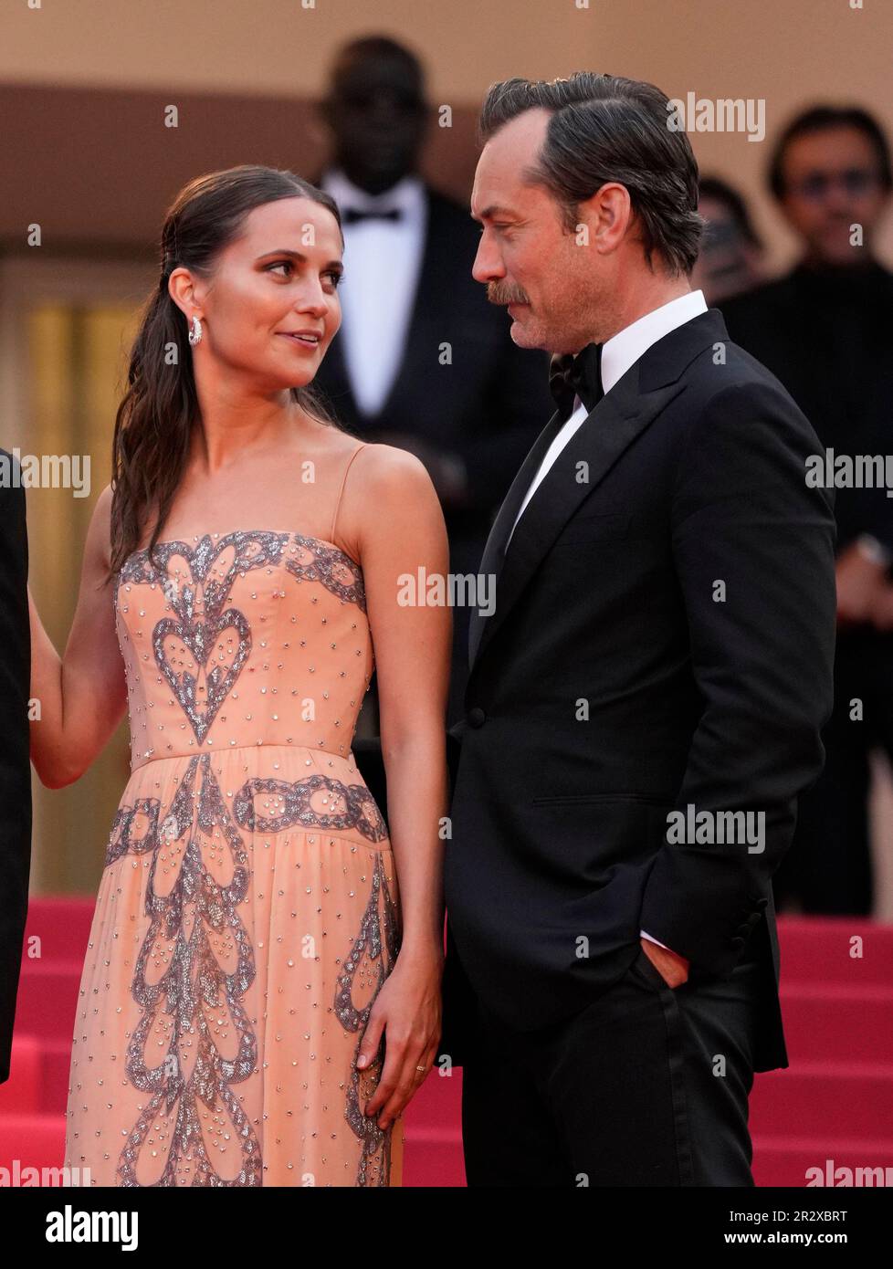 Alicia Vikander, left, and Jude Law pose for photographers upon arrival ...