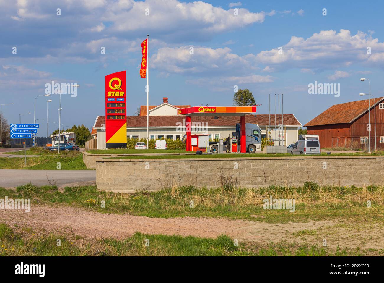 View of self service Q star gasoline station on blue sky background ...