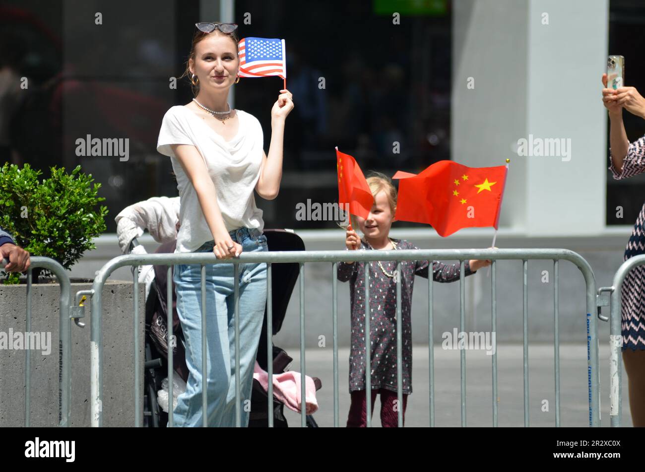 New York City, United States. 21st May, 2023. Spectators hold chinese ...