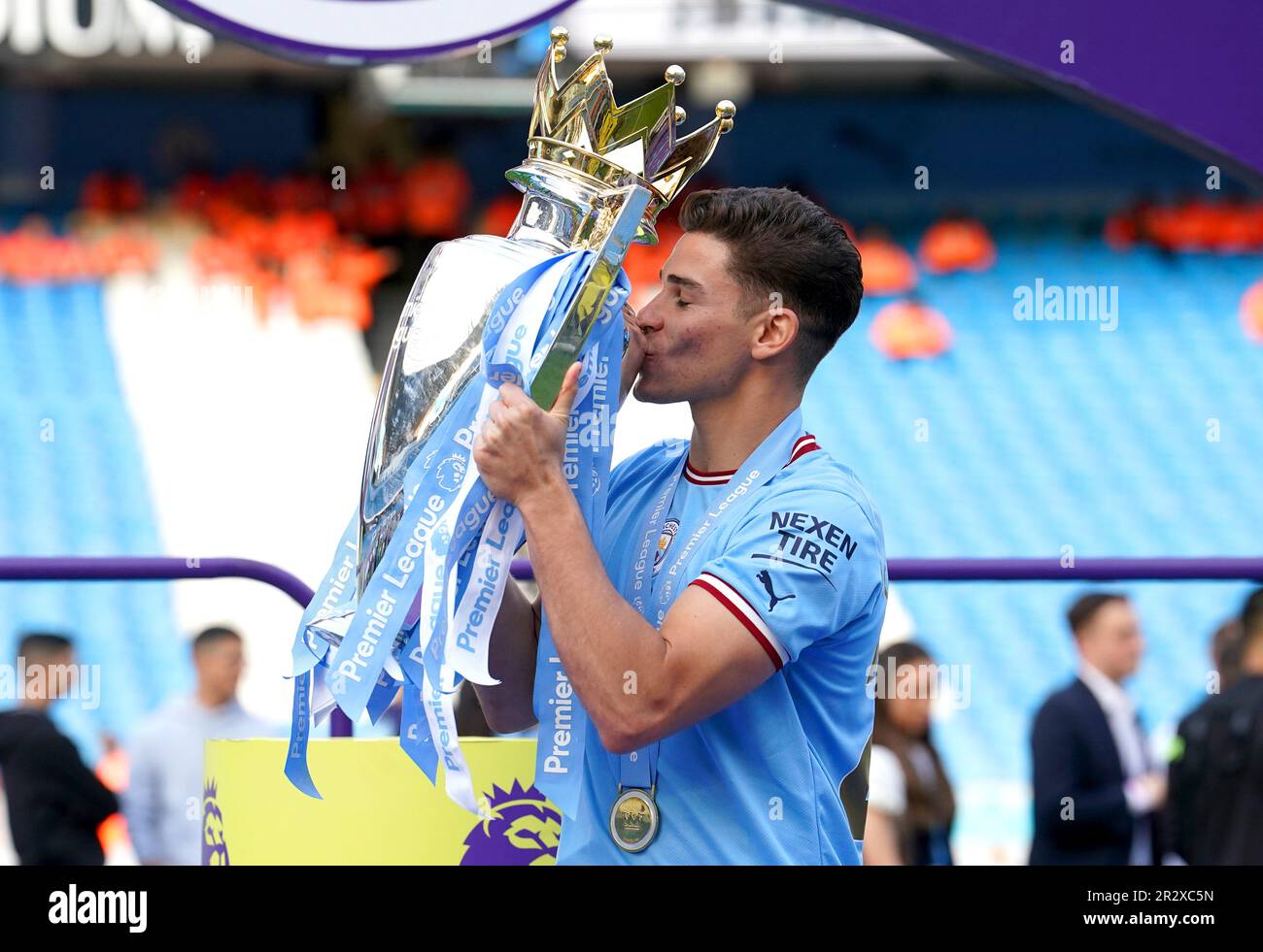 Manchester City's Julian Alvarez kisses the Premier League trophy ...