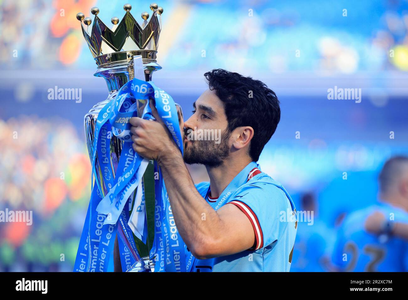 Ilkay Gundogan #8 of Manchester City kisses the Premier League trophy ...
