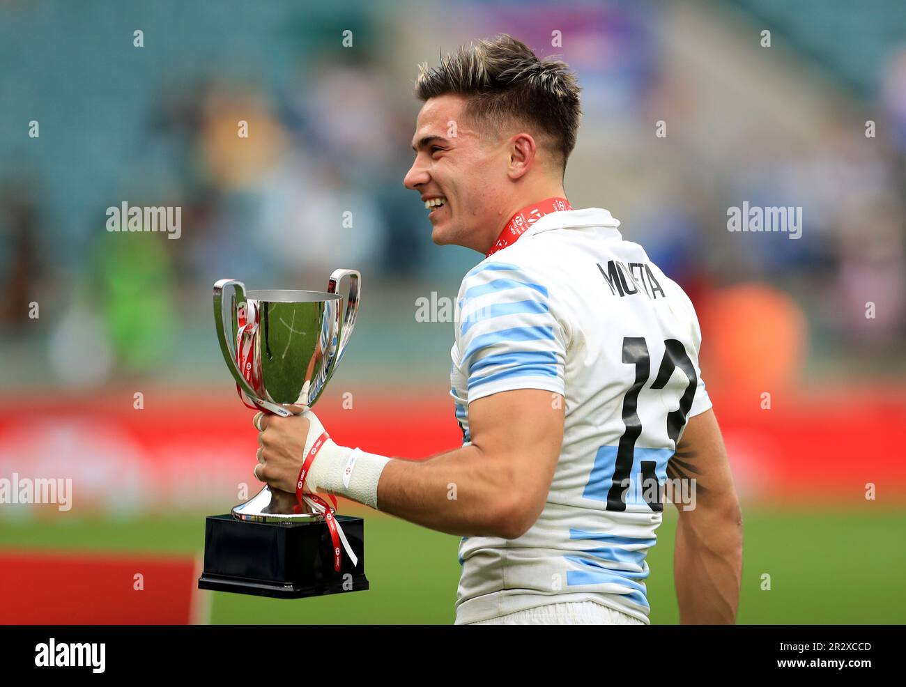 Argentina's Marcos Moneta celebrates with the trophy after beating Fiji ...