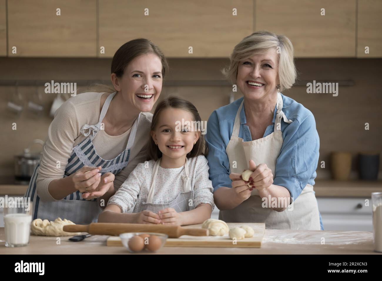 Family cooking together homemade pastries, smile pose look at camera ...