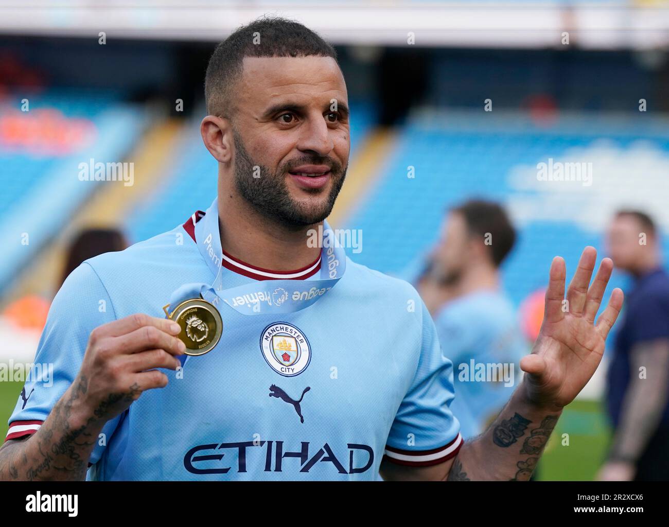 Manchester, UK. 21st May, 2023. Kyle Walker of Manchester City holds up ...