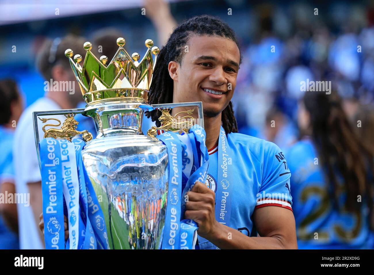 Nathan Ake #6 of Manchester City with the Premier League trophy after ...