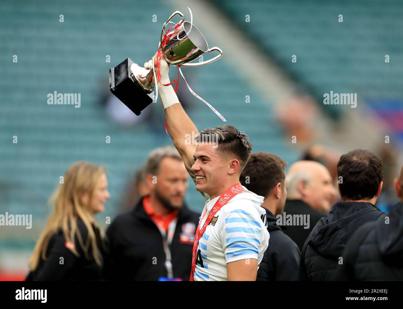 Argentina's Marcos Moneta celebrates with the trophy after beating Fiji ...