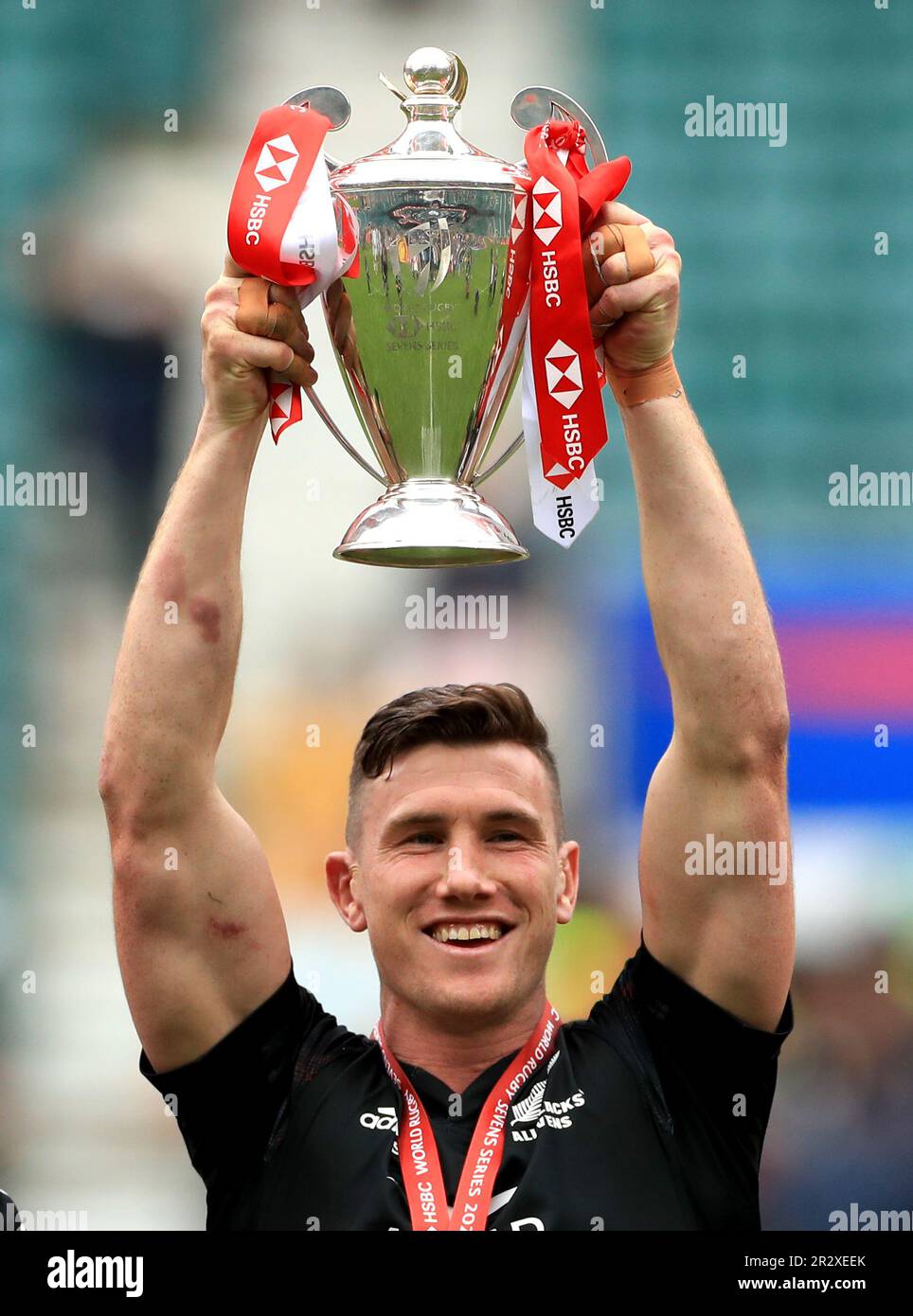 New Zealand's Sam Dickson lifts the HSBC World Series trophy after the ...