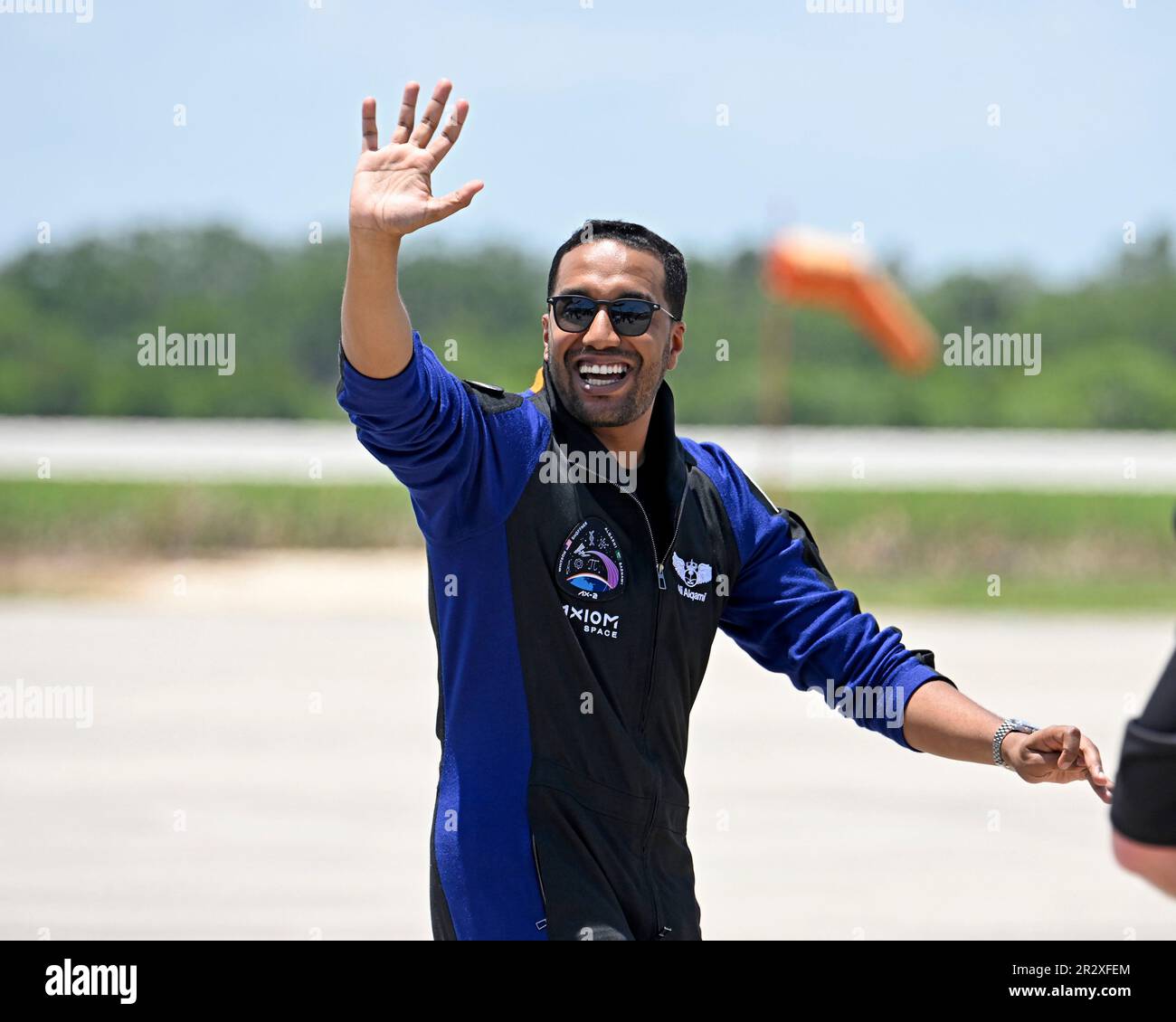 Ali AlQuarni waves to family members after arriving at the Kennedy ...