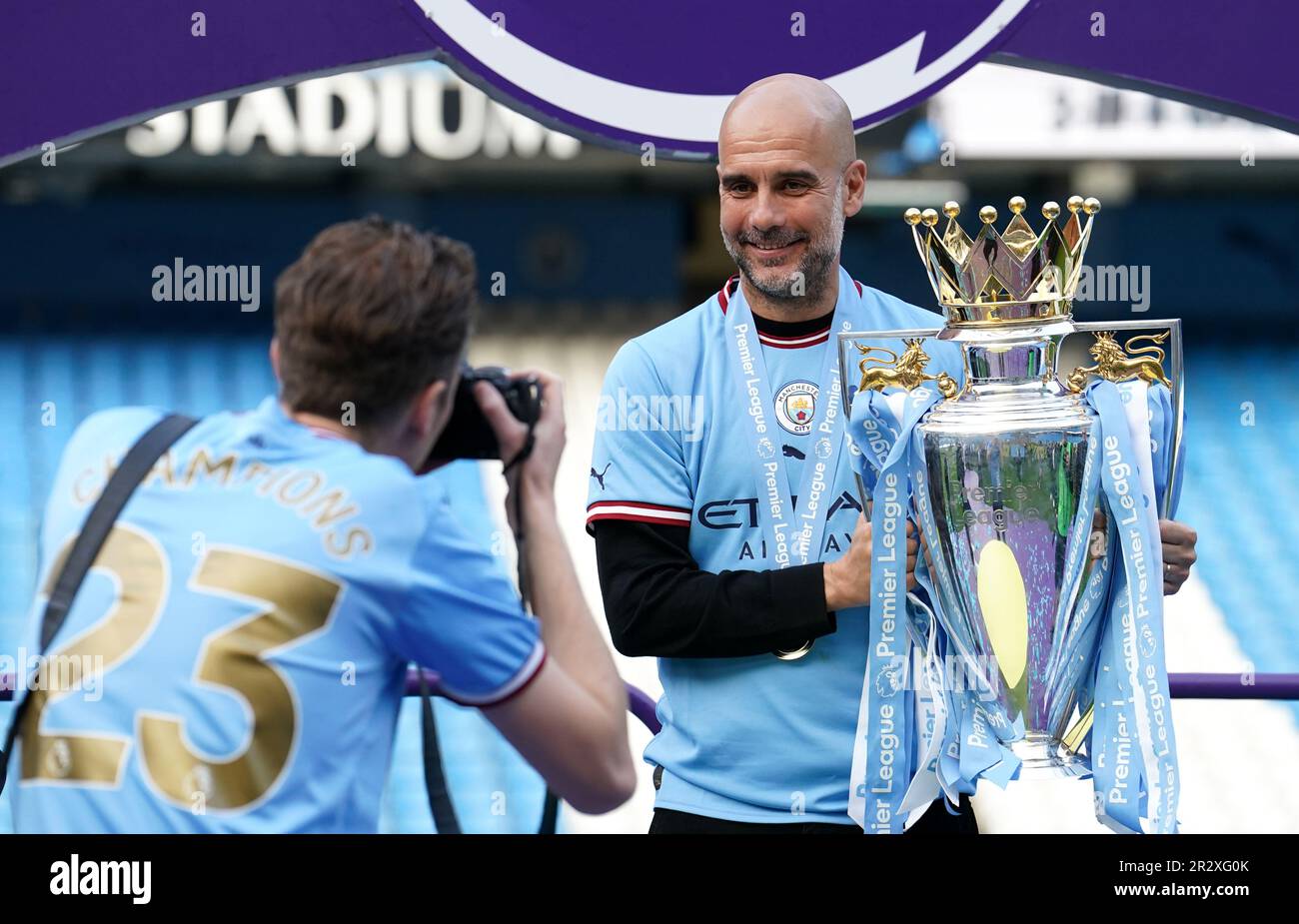 Manchester City manager Pep Guardiola poses for a photograph with the ...