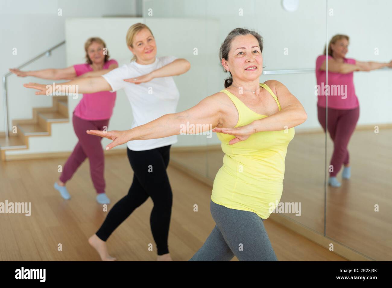 Three women are dancing Stock Photo - Alamy