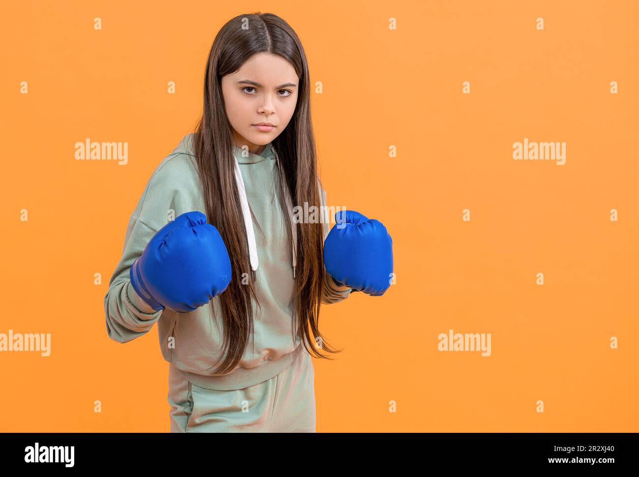 serious teen boxing girl on background. photo of teen boxing girl ...