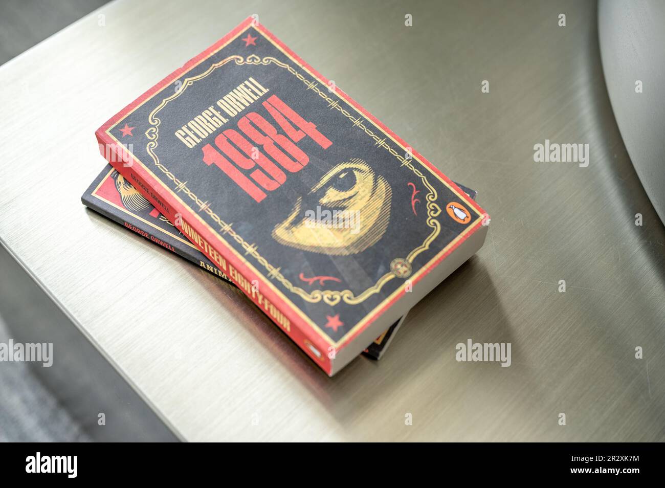 Calgary, Alberta - May 19, 2023: George Orwell's 1984 book on a coffee ...