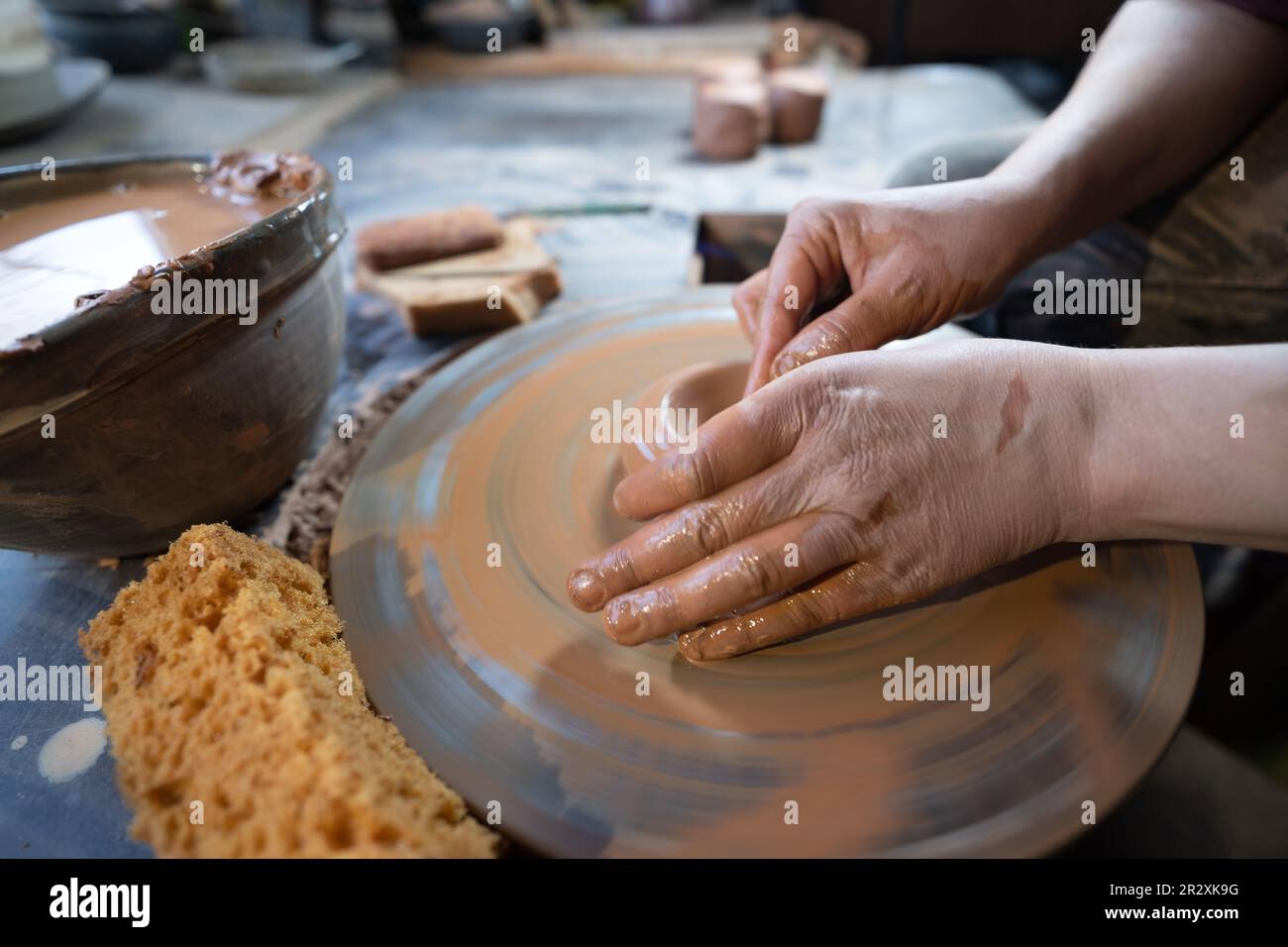 ceramics, workshop, ceramic art concept - close-up of man's hands ...