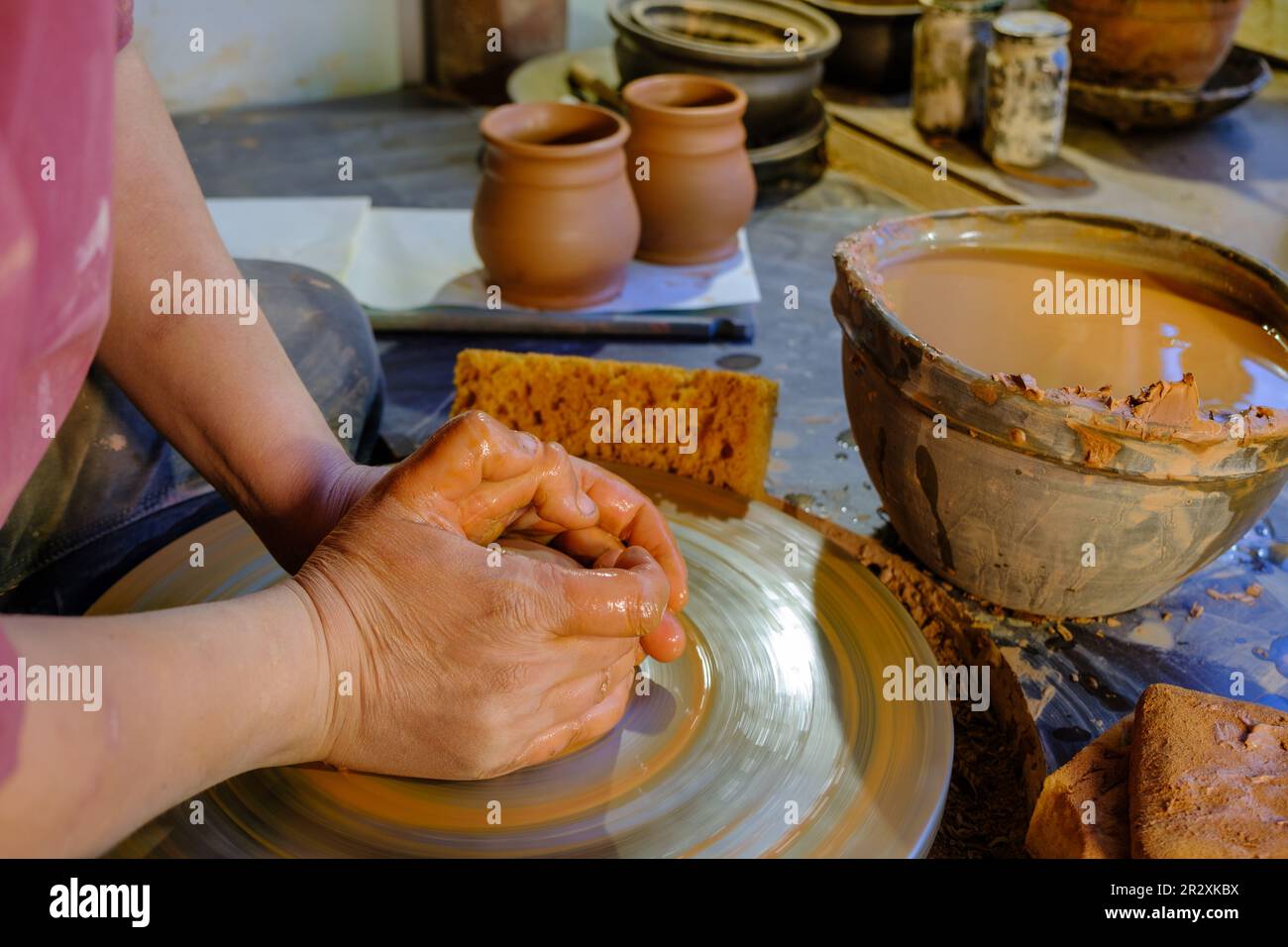 ceramics, workshop, ceramic art concept - close-up of man's hands ...