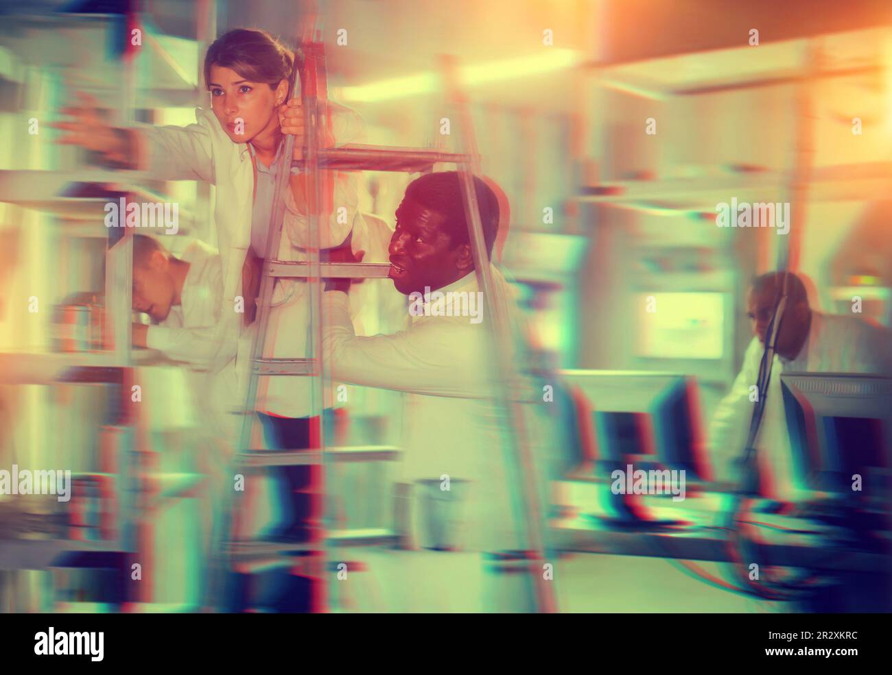 Man helps woman in finding a key in quest room Stock Photo - Alamy