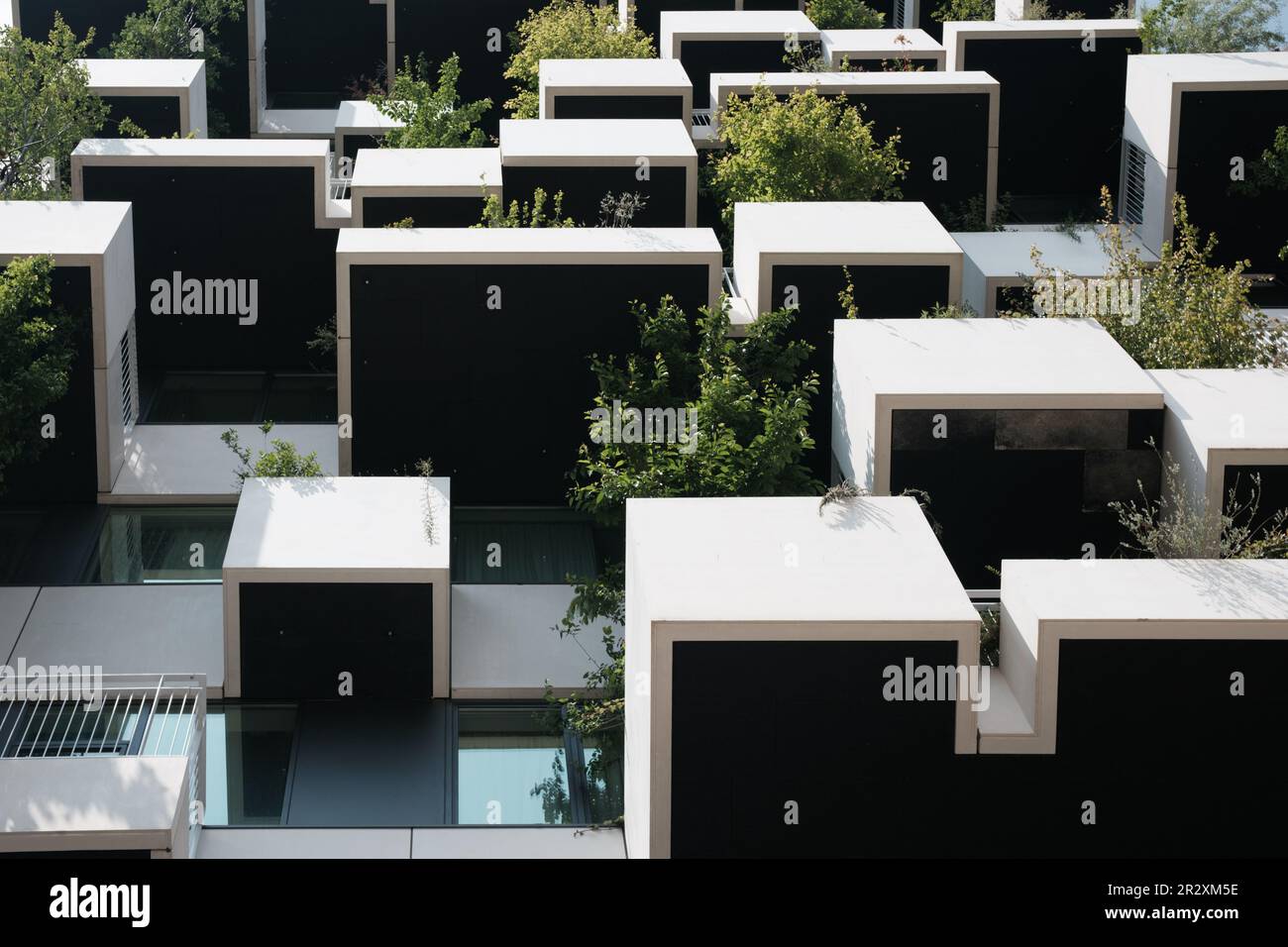 Sustainable and eco-friendly modern apartment building with balconies ...