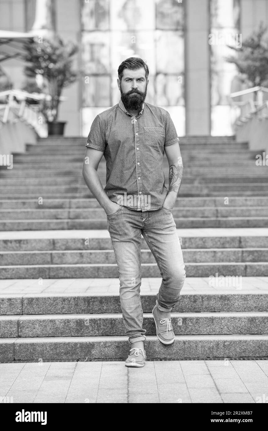 bearded man walking downstairs. full length of man with beard. hipster ...