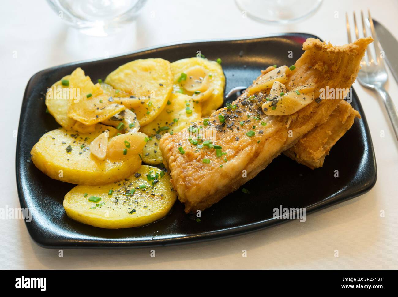 Roasted ray wings with potatoes Stock Photo - Alamy