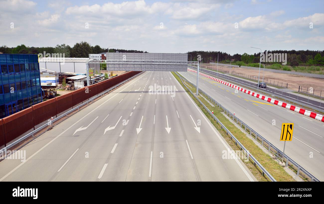 Road system on a blue cloudy day.View on a concrete highway. Modern ...