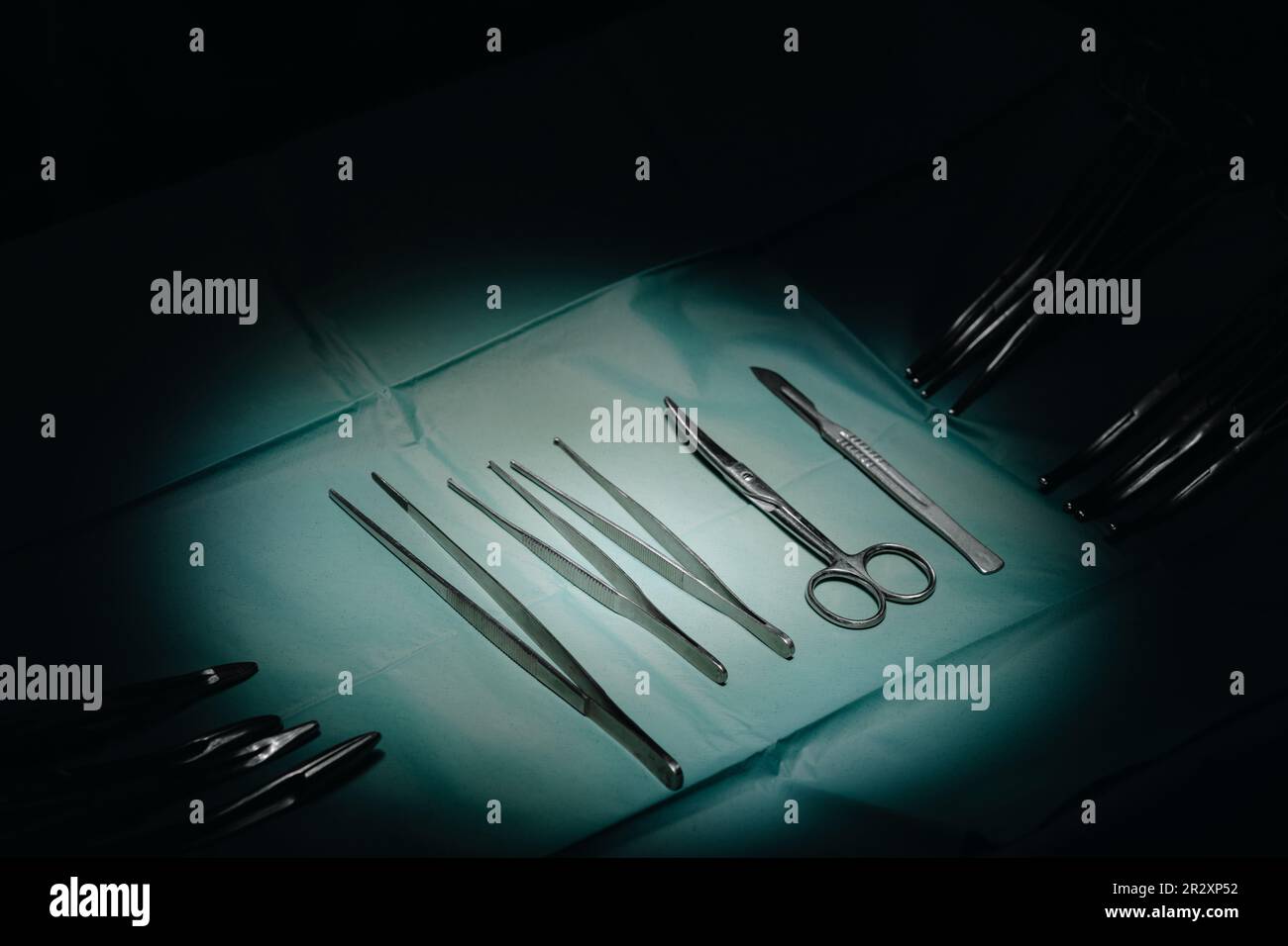 Standard surgical instruments on blue sterilized package in hospital ...