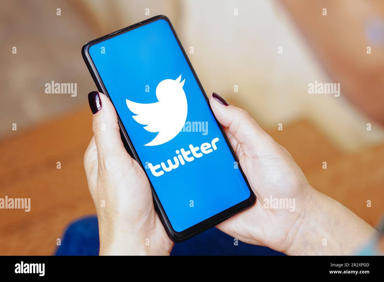 In this photo illustration, the Twitter logo is displayed on a ...