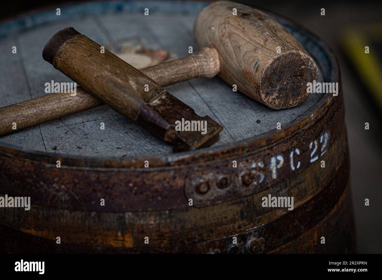 Hammer and chisel on whisky barrel Stock Photo - Alamy